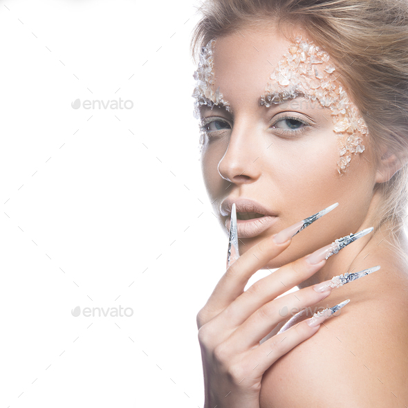 Beautiful fashion model with long nails, creative makeup and manicure ...