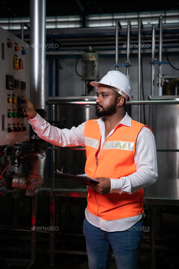 Engineer of Mechanical Plant Checking the electronic circuit of the ...