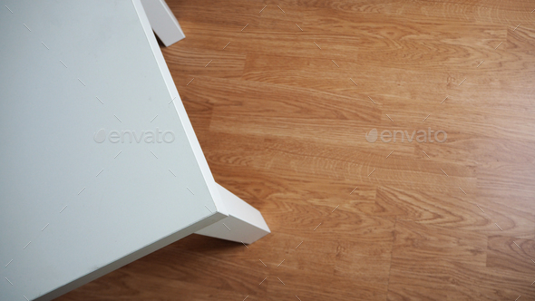 White desk top angle view with wood background. Stock Photo by puibunny