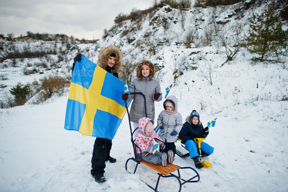 Scandinavian family with Sweden flag in winter swedish landscape. Stock ...
