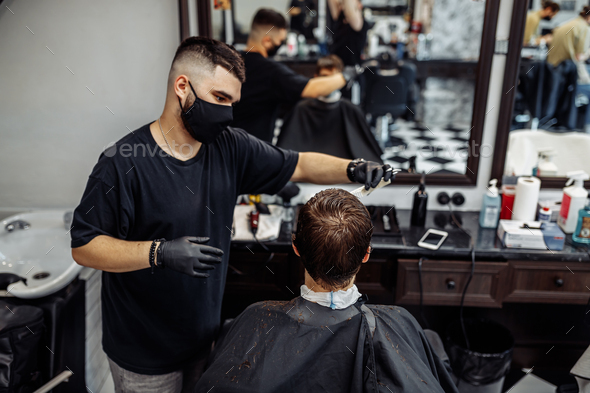 Creating a cool haircut and styling in a barbershop. Stock Photo by ...
