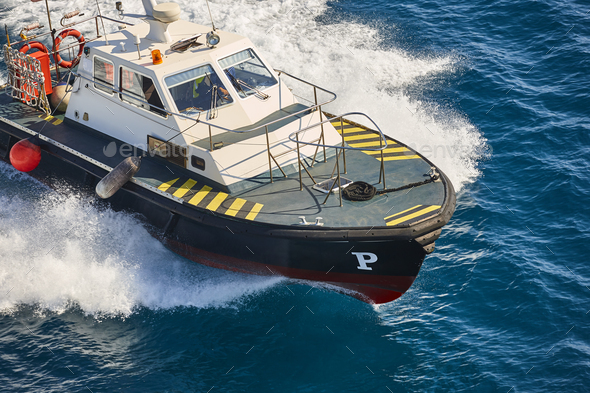 Pilot vessel operating on the sea. Harbor maritime control. Nautical ...