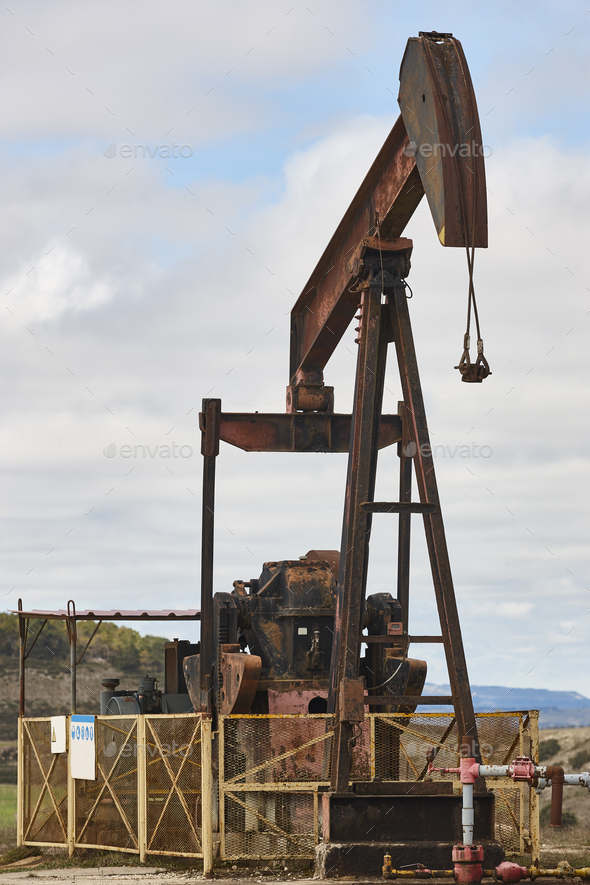 Oil pumping machine. Pump jack. Petroleum extraction. Global warming ...