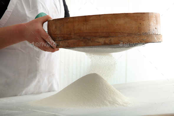 chef sifting flour for bread making Stock Photo by safakc1 | PhotoDune