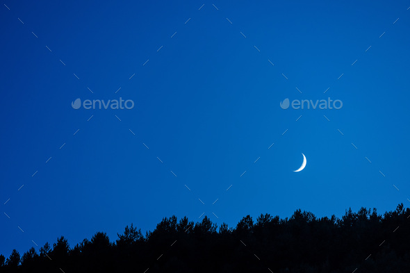 thin crescent moon in the blue sky of the twilight Stock Photo by Raul ...