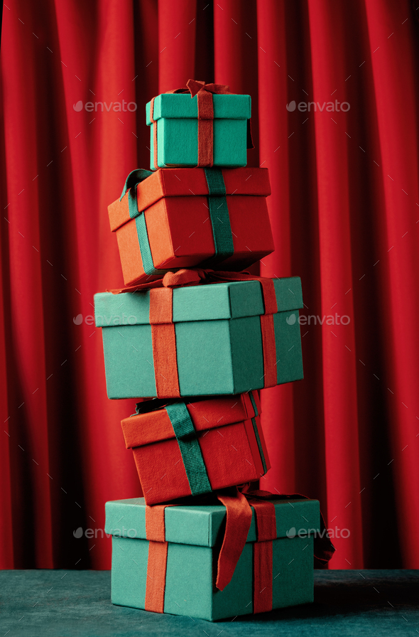 Green and red gift boxes on red curtain background Stock Photo by ...