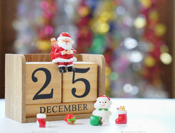 Santa sitting on wooden block date dated 25 December Stock Photo by areec1