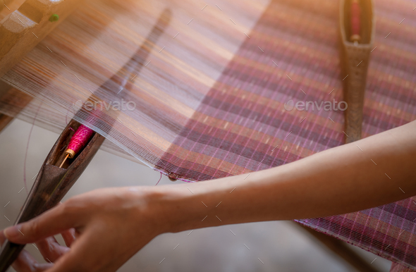 Woman working on weaving machine for weave handmade fabric. Textile ...