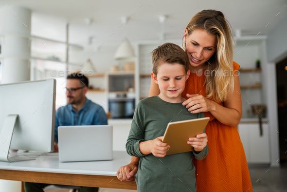 Distance learning, online education, home work concept. Family with ...