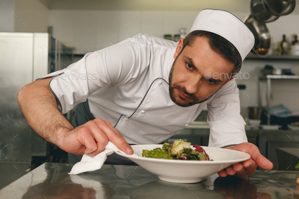 Chef preparing salad in the modern kitchen of restaurant. Tasty and ...