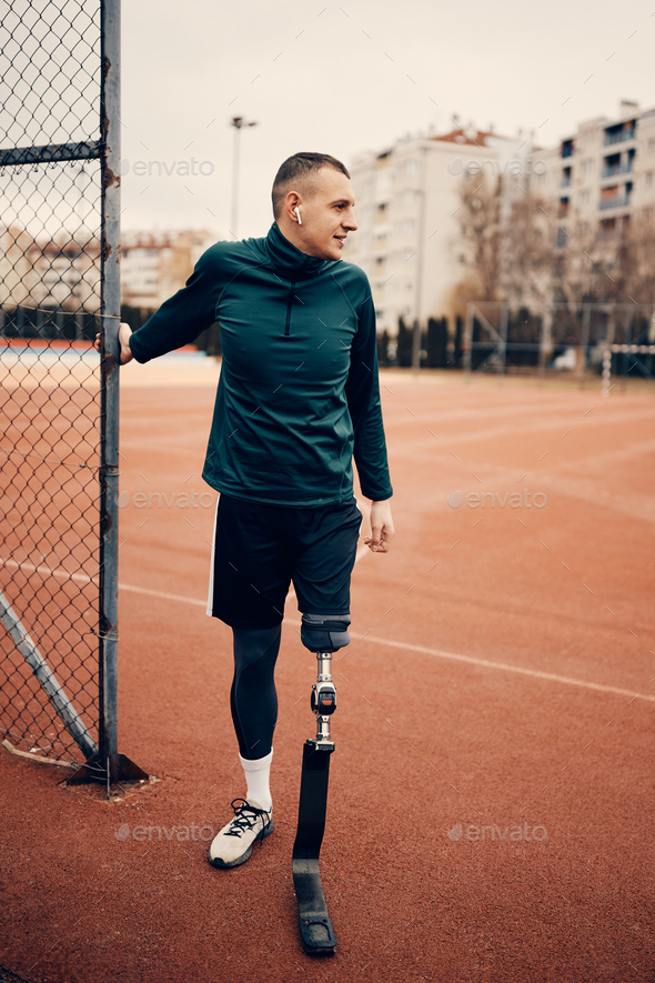 Full length of athletic man with a prosthetic leg during sports ...