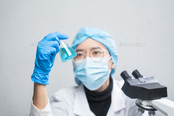 professional research scientist using microscope in science chemistry ...