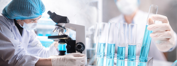 professional research scientist using microscope in science chemistry ...