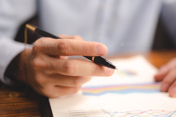 business man person using a pen to sign a agreement document paper to ...