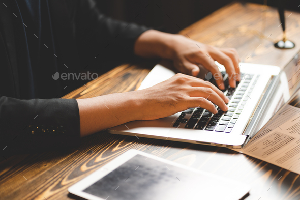professional business person typing on computer laptop desk at office ...