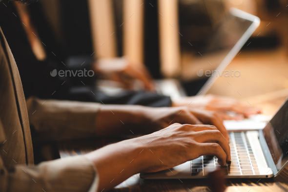 professional business person typing on computer laptop desk at office ...