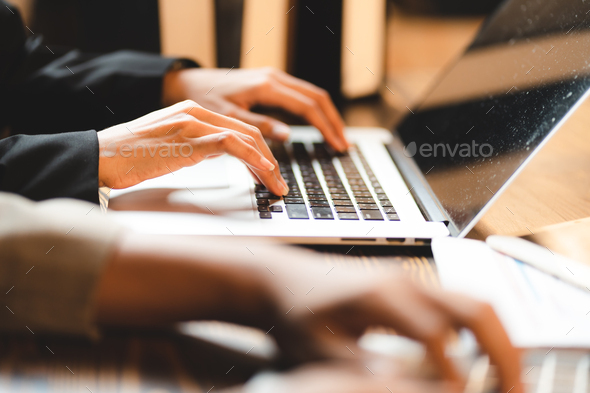 professional business person typing on computer laptop desk at office ...