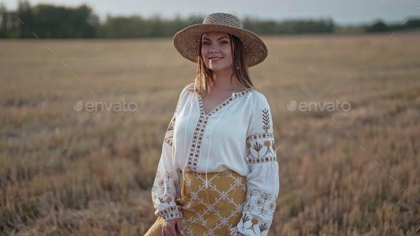 Portrait of ukrainian woman in wheat field after harvesting.Attractive ...