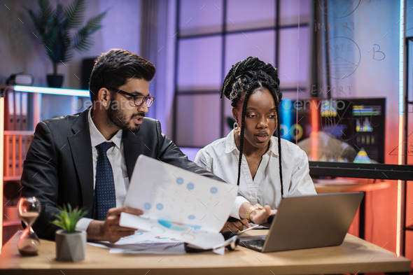 Two multicultural company workers arab financial expert and african ...