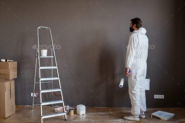 Man Starting To Paint Walls Stock Photo by Media_photos | PhotoDune