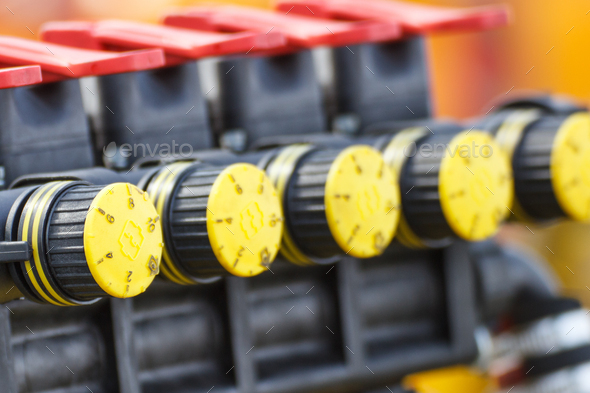 Operating control buttons or knobs in industrial machine. Technology ...