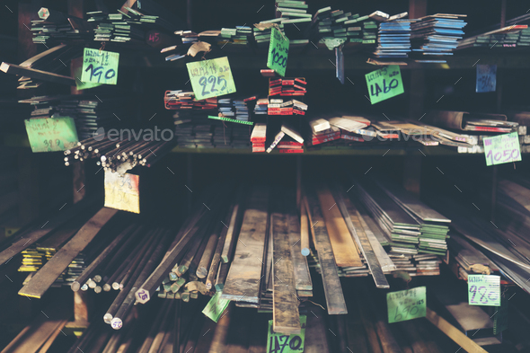 Stack of steel pipes in metal factory shop Stock Photo by ckstockphoto