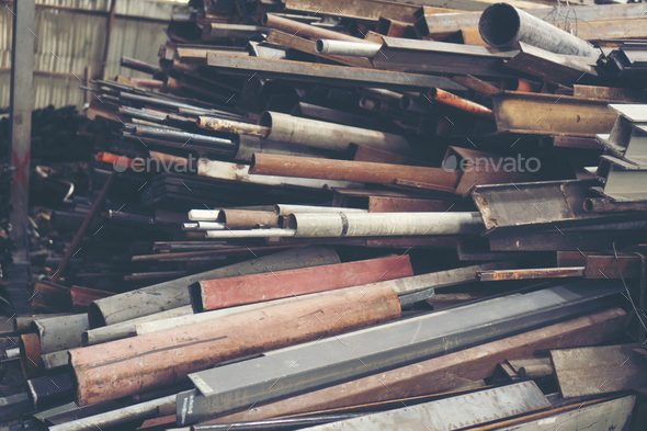 Stack of steel pipes in metal factory shop Stock Photo by ckstockphoto