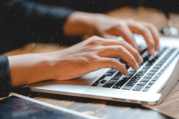 professional business person typing on computer laptop desk at office ...