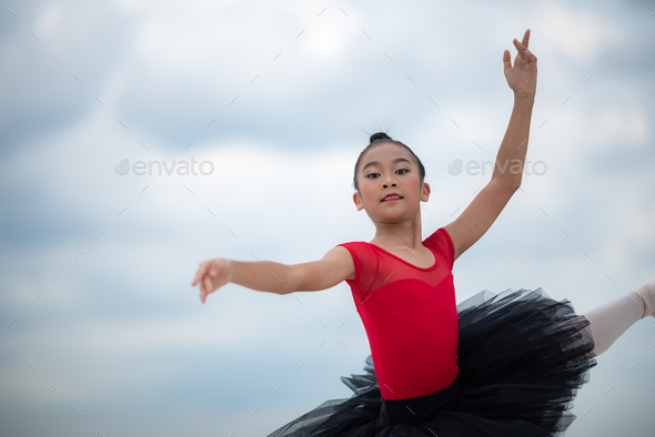 Cute little ballet dancer performing handstand posture while practicing ...
