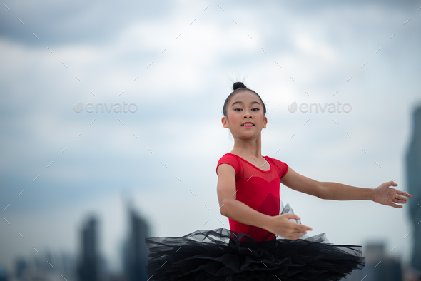 Cute little ballet dancer performing handstand posture while practicing ...