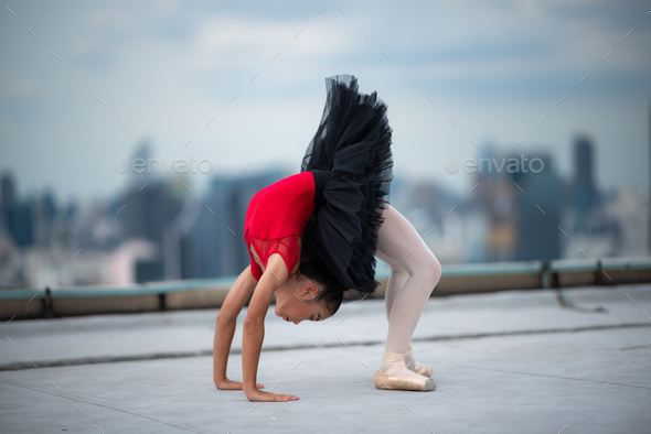 Cute little ballet dancer performing handstand posture while practicing ...