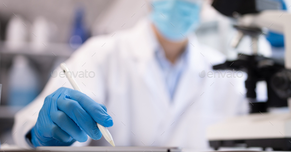 professional research scientist using microscope in science chemistry ...