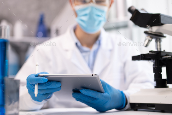 professional research scientist using microscope in science chemistry ...