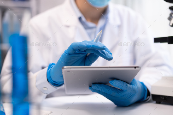 professional research scientist using microscope in science chemistry ...
