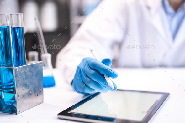 professional research scientist using microscope in science chemistry ...