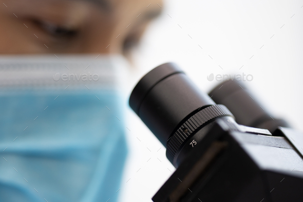 professional research scientist using microscope in science chemistry ...