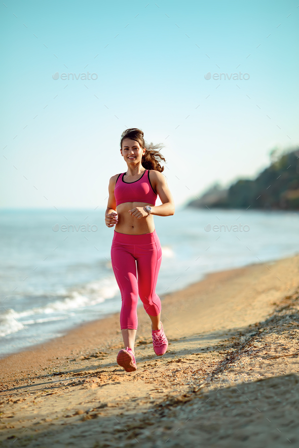Fitness runner woman running on beach. Sporty athlete training cardio ...