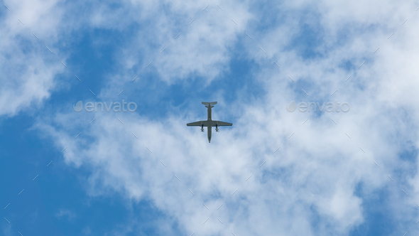 Commercial passenger aircraft across flying over head. Plane fly in day ...