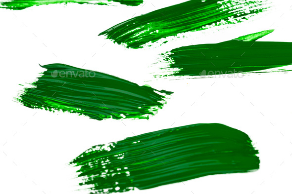 green stroke of the paint brush on white paper Stock Photo by FabrikaPhoto