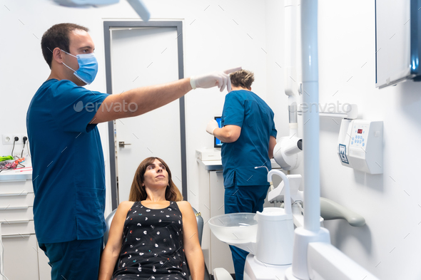 Dental clinic, routine medical check-up of a young woman with the ...