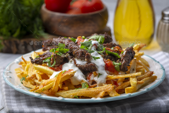 Turkish food; Cokertme Kebab - Beef meat kebab with yoghurt and french ...