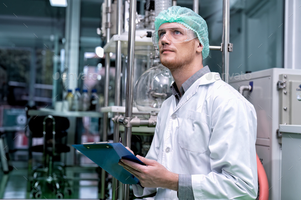 maintenance engineer scientist routine check the distillation glass ...