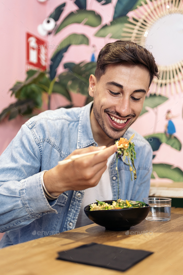 Happy Man Eating Poke Bowl Stock Photo by nunezimage | PhotoDune
