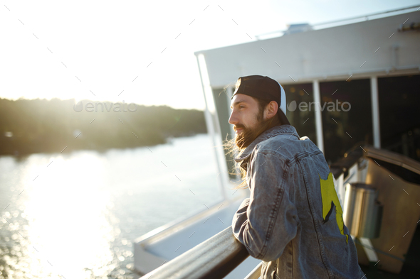 Guy enjoys a ferry ride or ship, sailing to the island tourist ...