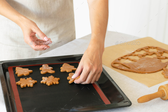 Christmas shortbread snowflakes. Women's hands hold traditional New ...