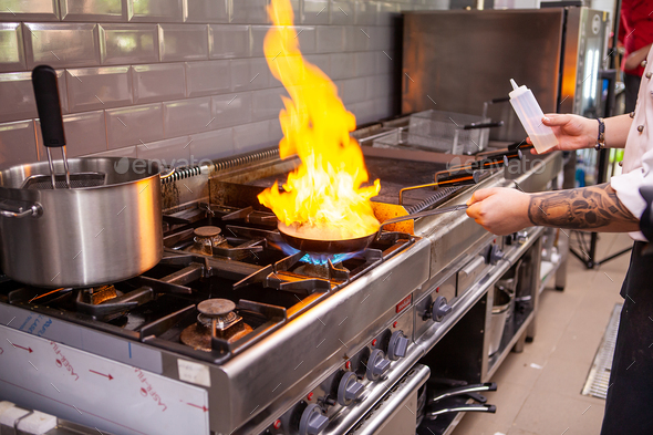Chef making flambe beef on pan Stock Photo by DC_Studio | PhotoDune
