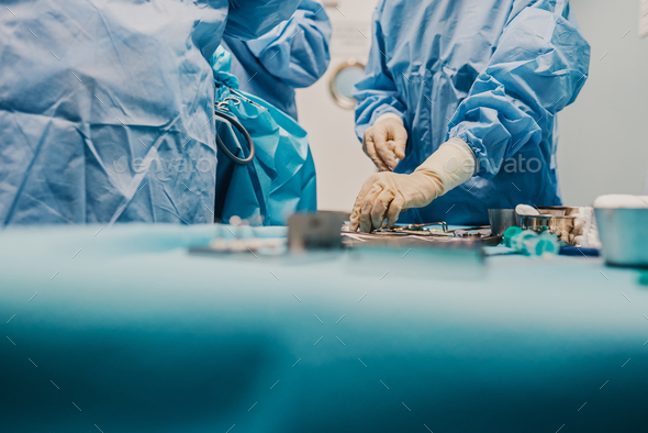 Medical team preparing surgical equipment for operation inside private ...