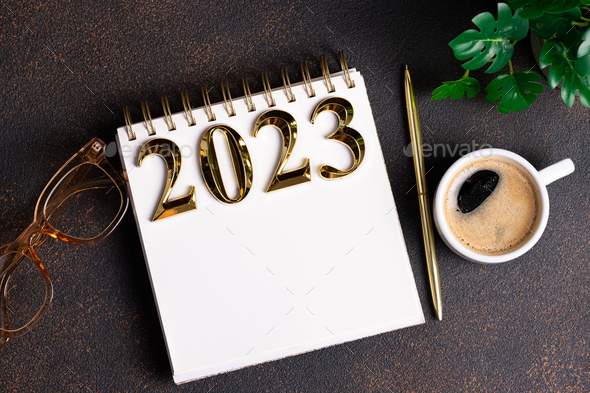 New year resolutions 2023 on desk. 2023 resolutions list with notebook ...