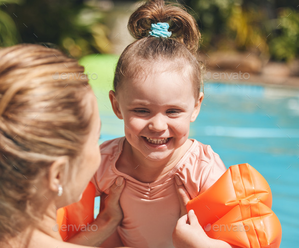 She loves the water. Cropped shot of an adorable little learning to ...