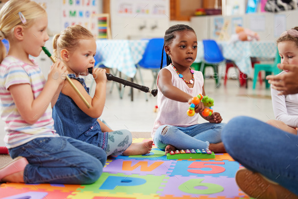 Shot of children learning about musical instruments in class Stock ...